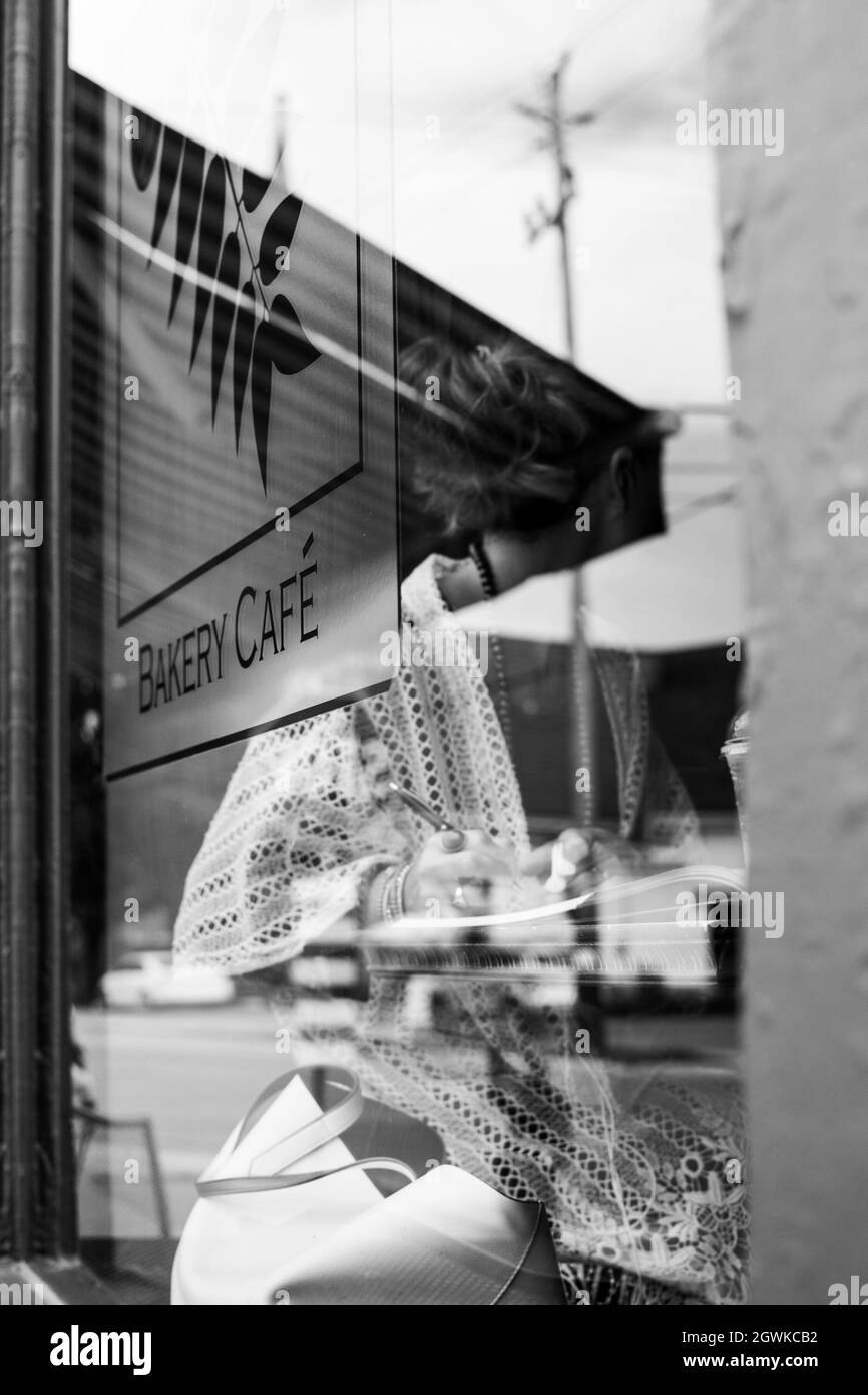 Person in coffee shop Black and White Stock Photos & Images - Alamy