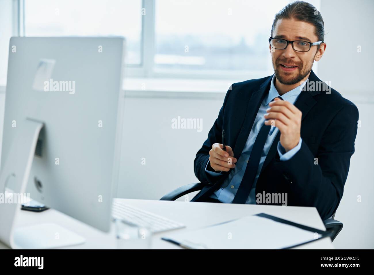 office worker at the desk with glasses work technologies Stock Photo ...