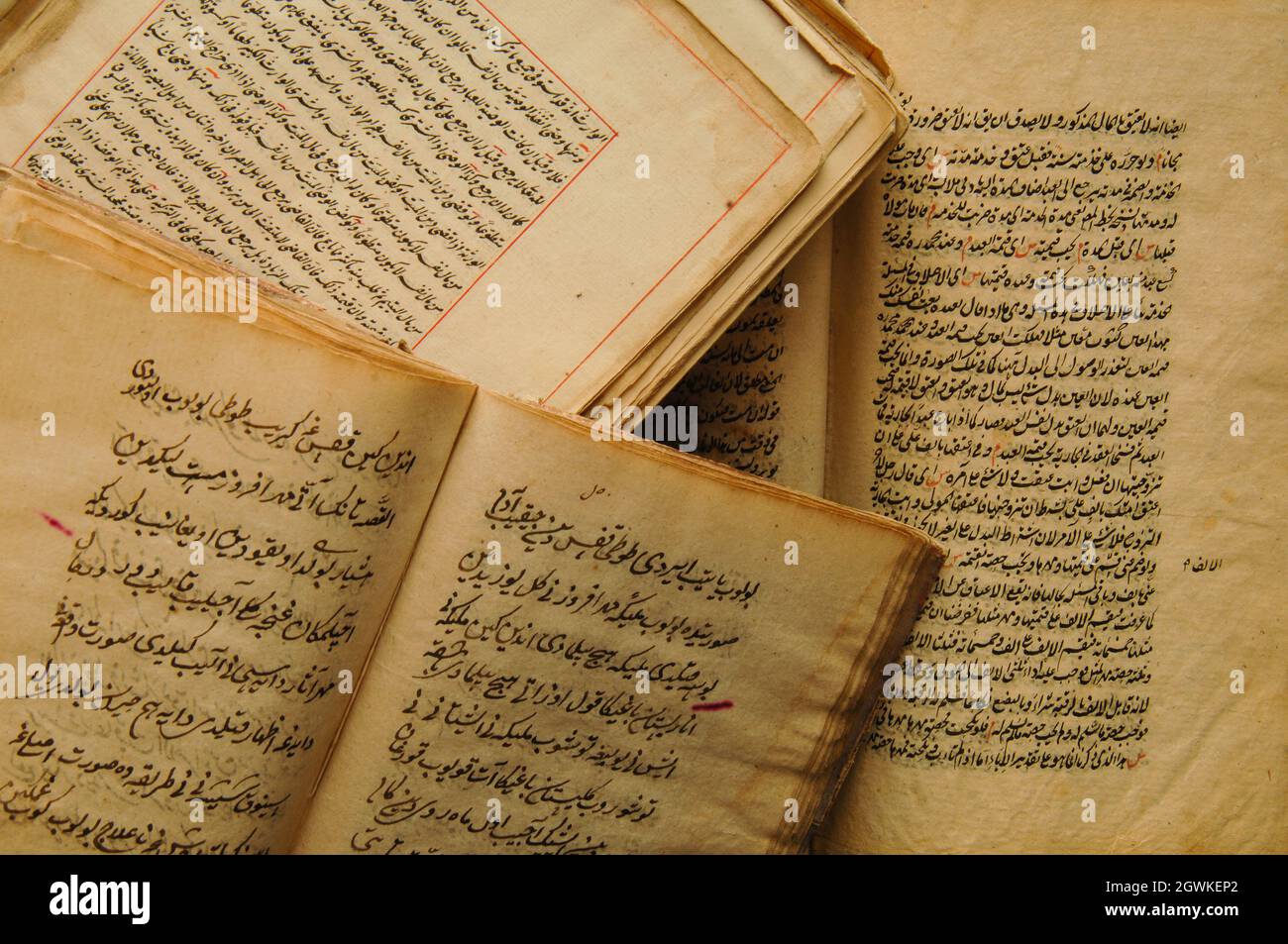 Stack of open ancient books in Arabic. Old Arabic manuscripts and texts ...