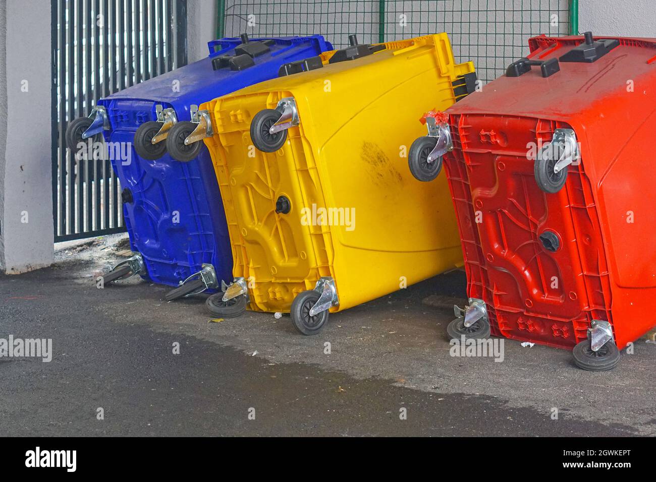 Three recycling containers turn on side Stock Photo - Alamy