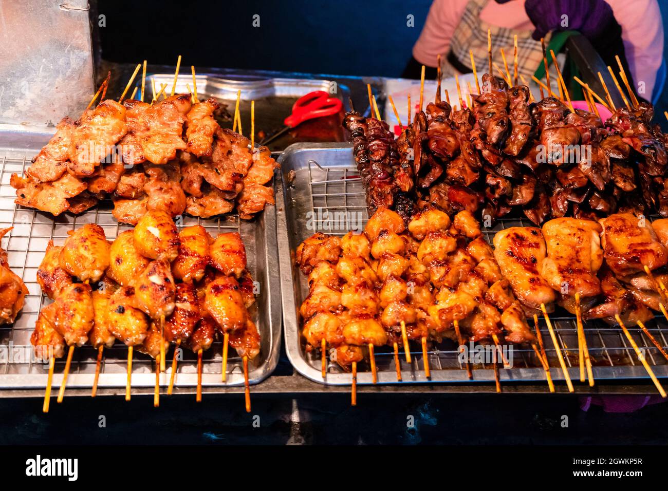 Snack and fried chicken stall at a market in Asia Stock Photo - Alamy
