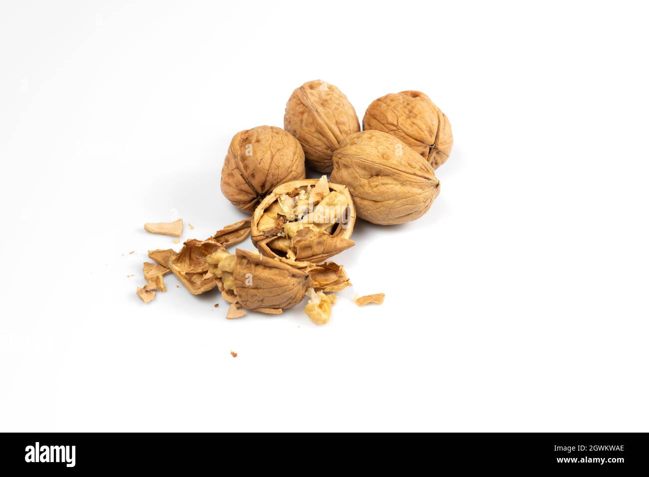 walnuts, whole walnuts on white background, cracked walnut Stock Photo ...