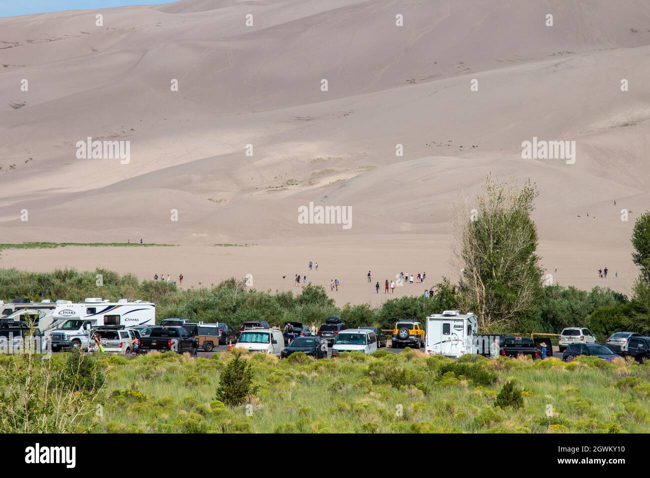 A crowded, full parking lot during summer of 2021 and the Covid19 ...