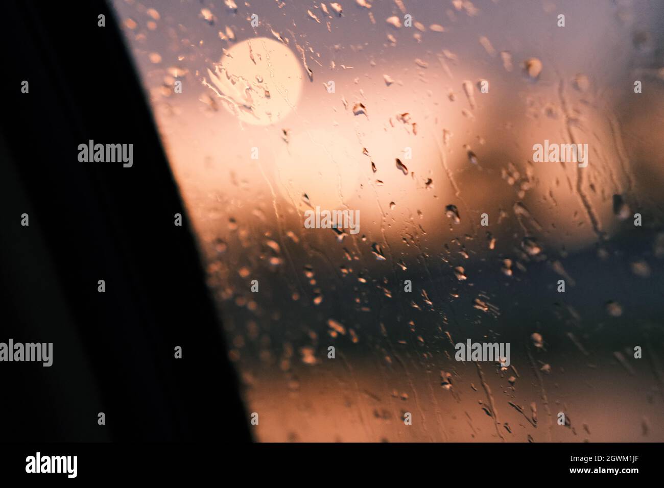 A window with some raindrops and bokeh lights background Stock Photo ...