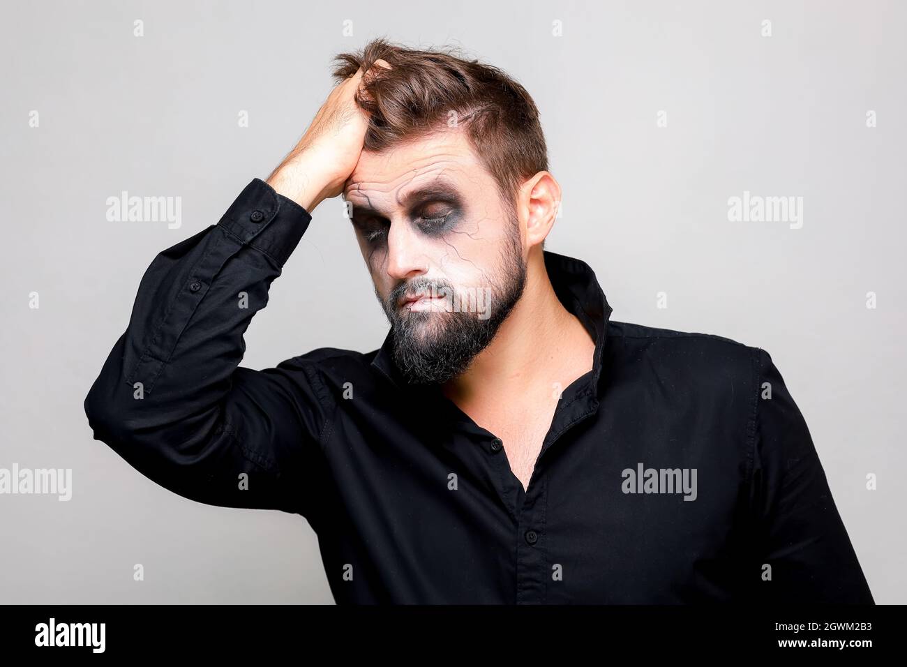 halloween and makeup for a bearded man who tears the hair on his head ...