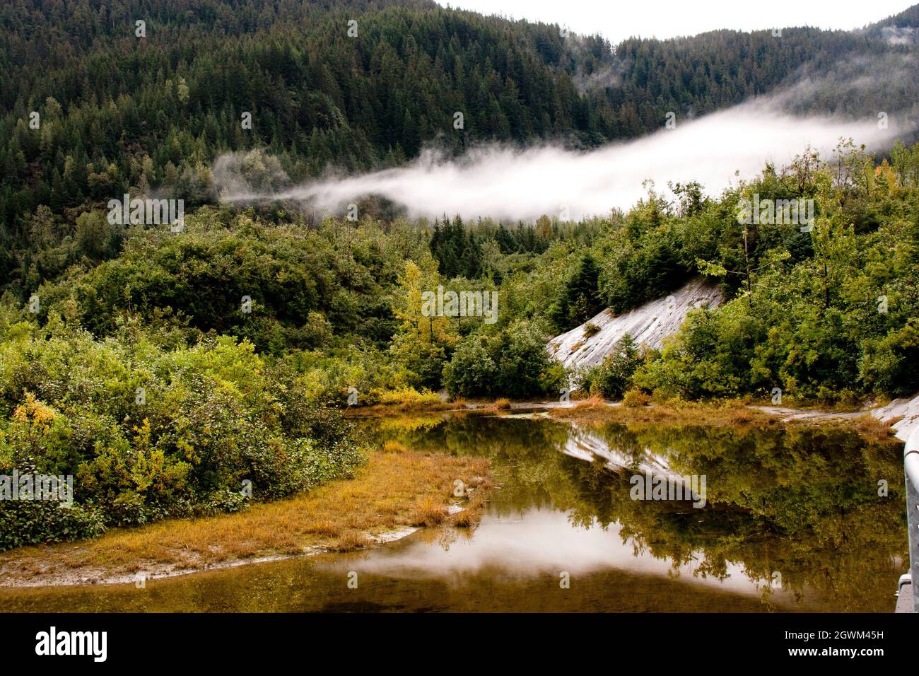 Small Lake and mountain mist Alaska east coast Stock Photo - Alamy