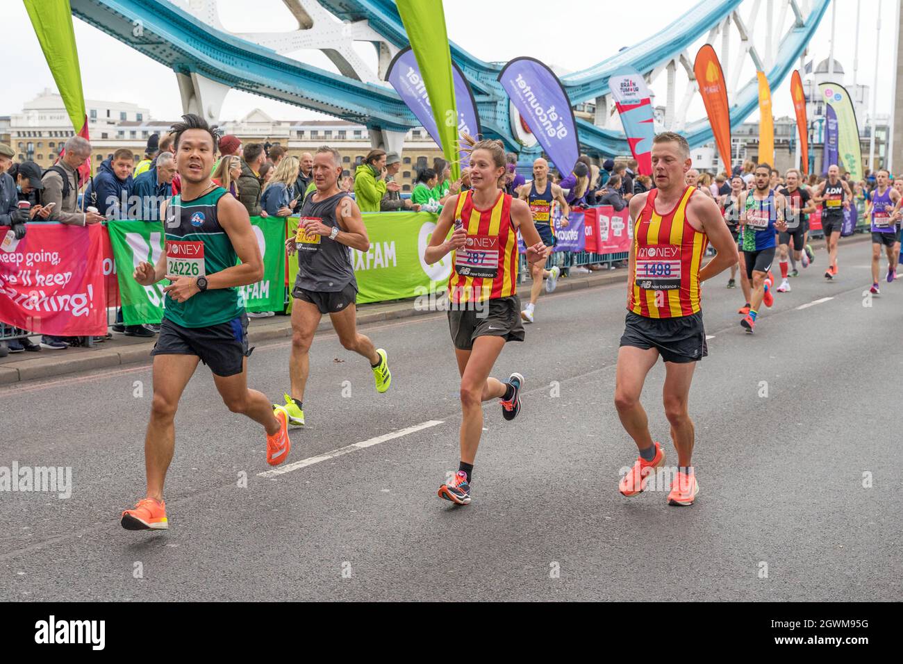 Runners completing the 41st London Marathon running over Tower Bridge ...