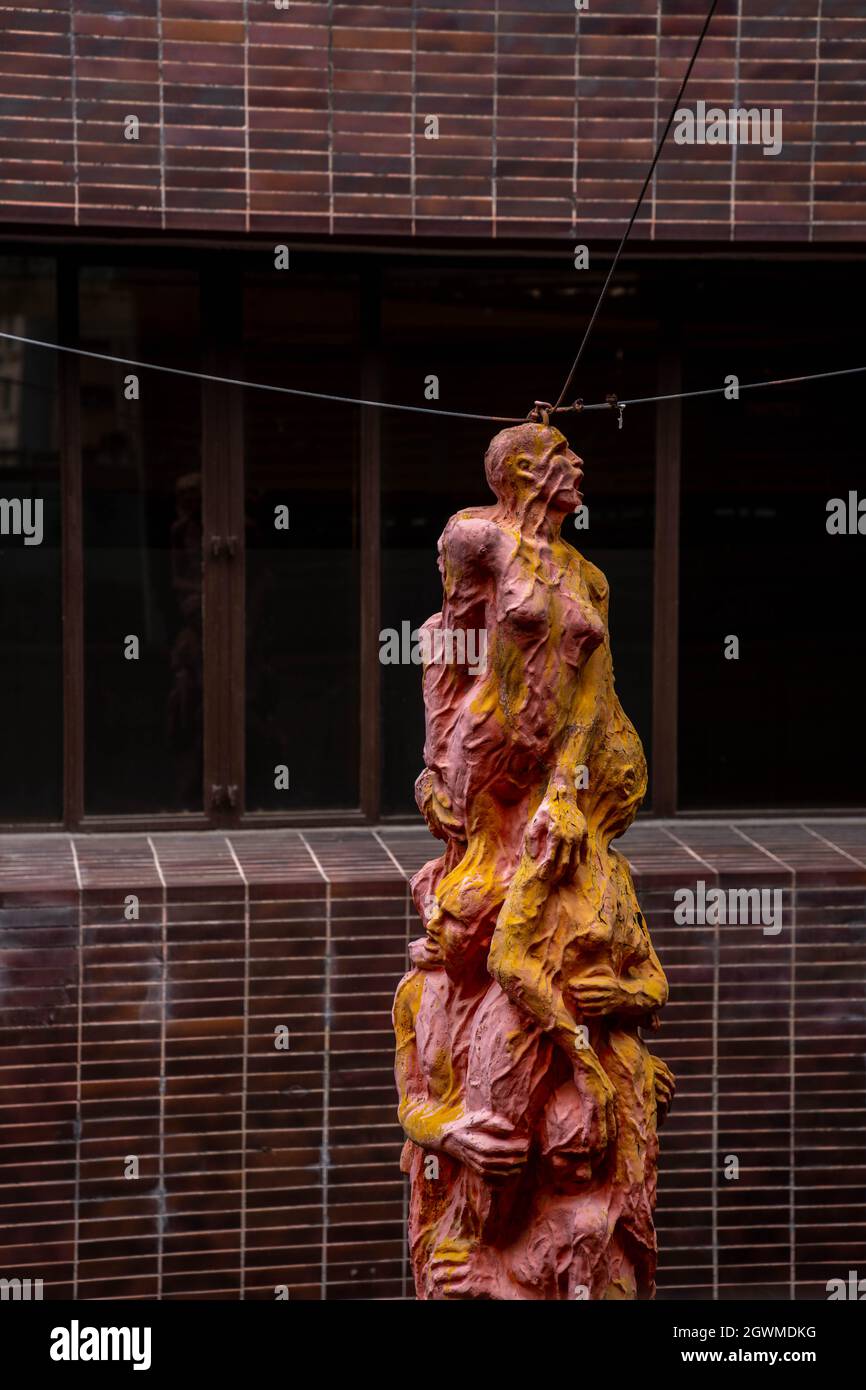 The top of the Pillar of Shame is pictured in front of darkened windows ...