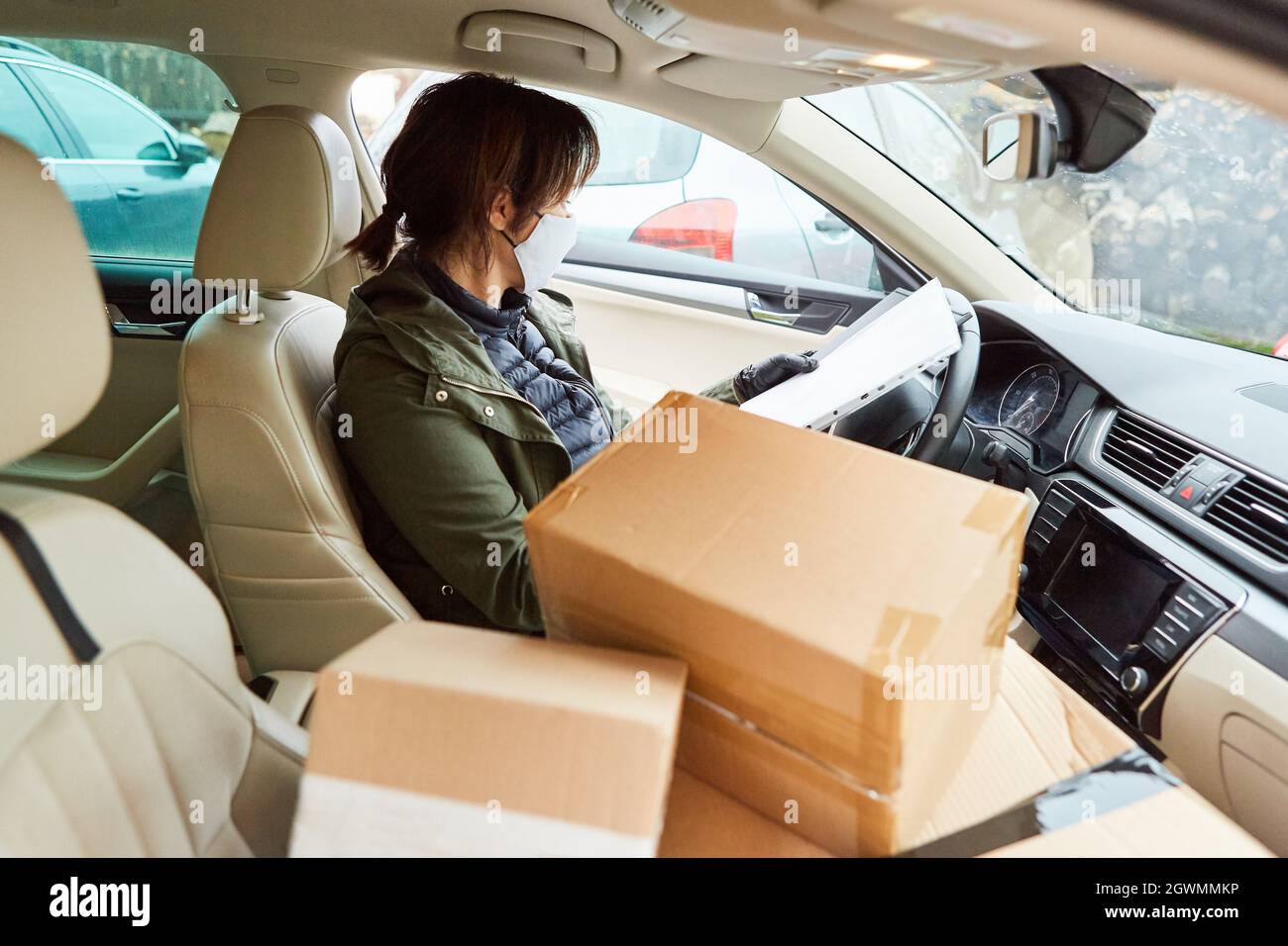 Woman loading car side hi-res stock photography and images - Alamy