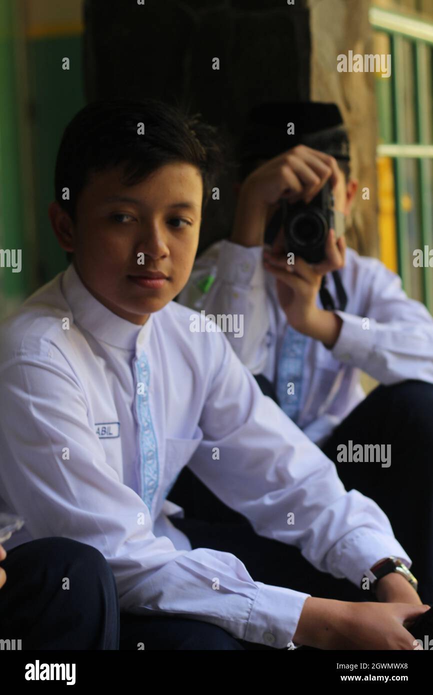 A Students Taking A Photo Of A Model Student Stock Photo - Alamy
