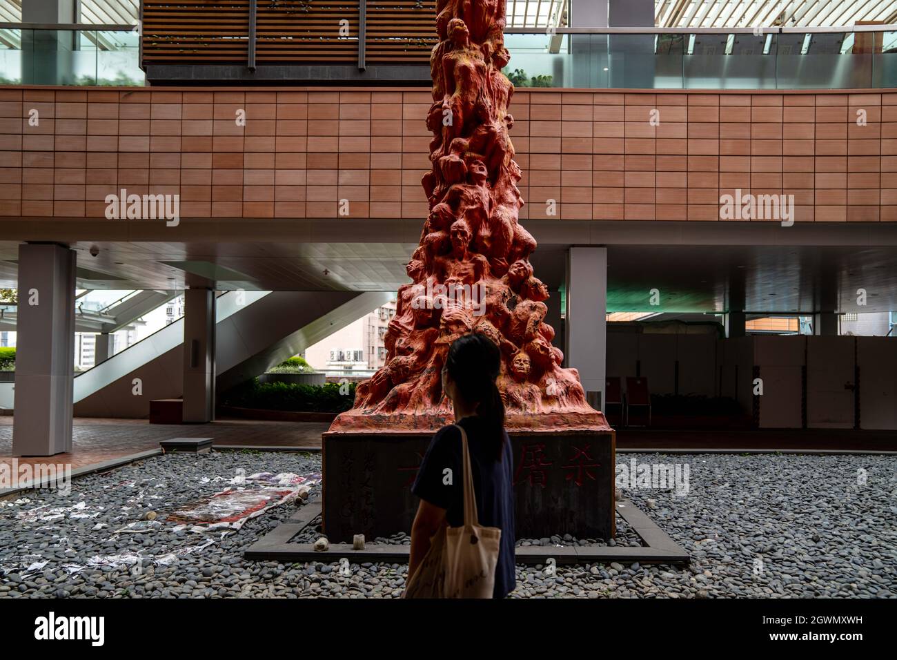 A woman stands in front of the Pillar of Shame. Standing at eight ...