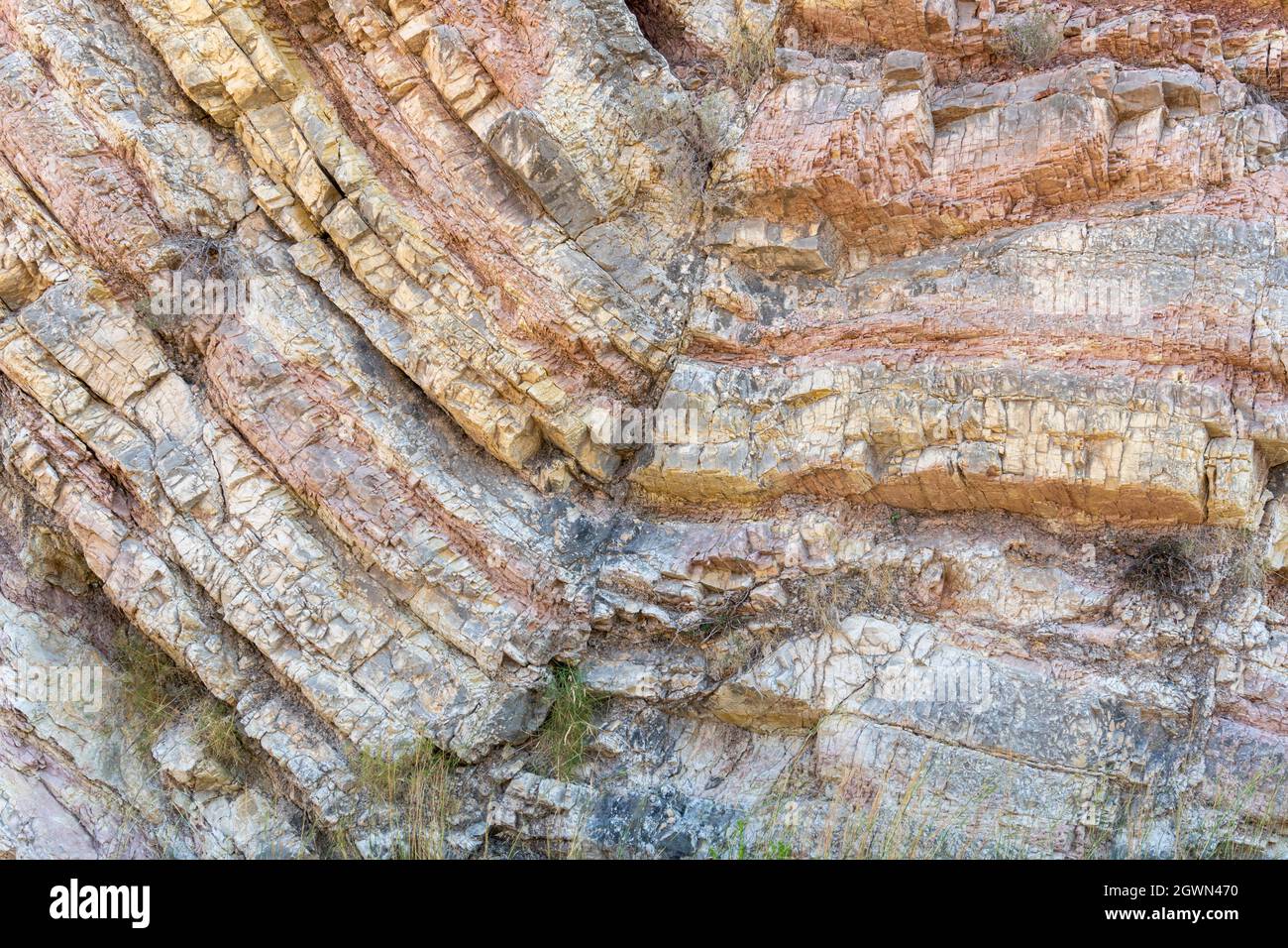 The rock formations on the side of a mountain with detail of the veins ...