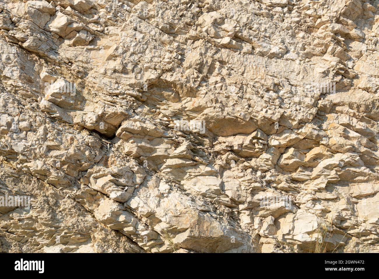 The rock formations on the side of a mountain with detail of the veins ...