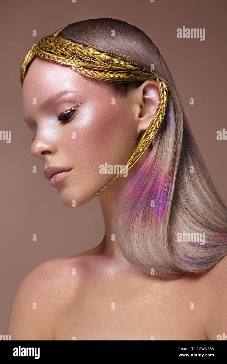 Beautiful girl with multi-colored hair and creative make up and ...
