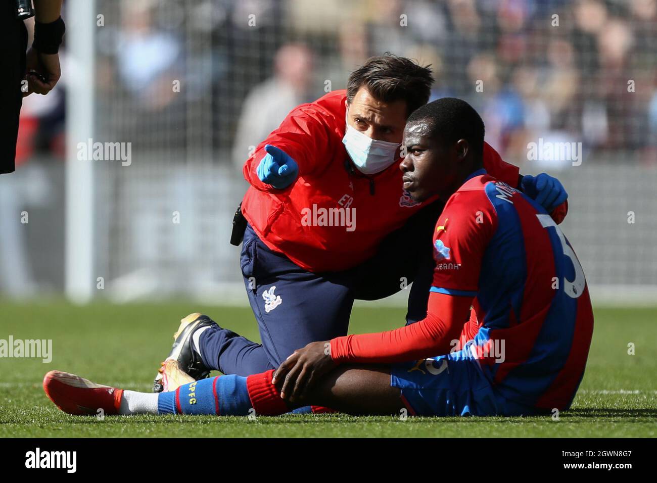 Tyrick Mitchell #3 of Crystal Palace receives medical attention from ...