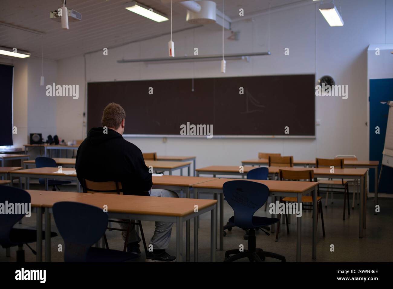 A Lonely Student In An Empty Classroom Stock Photo - Alamy