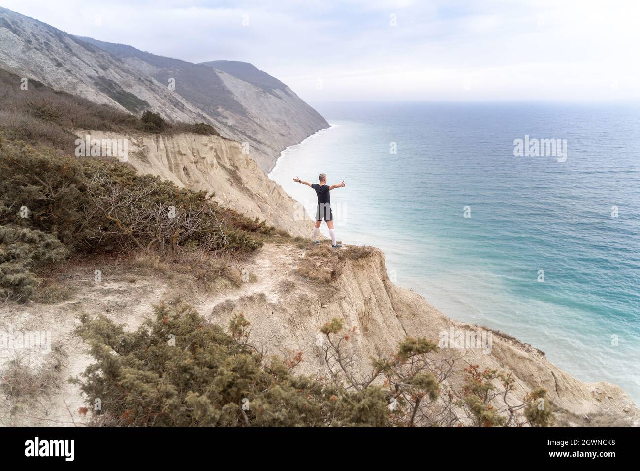 Happy confidence runner open arms outstretched celebrating or praying ...