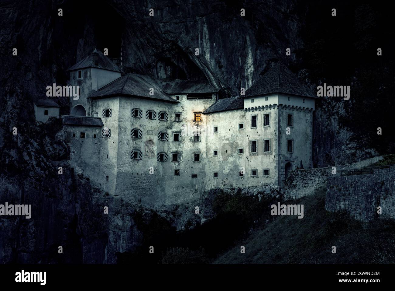 haunted mystic eerie predjama castle built into a mountain in the ...
