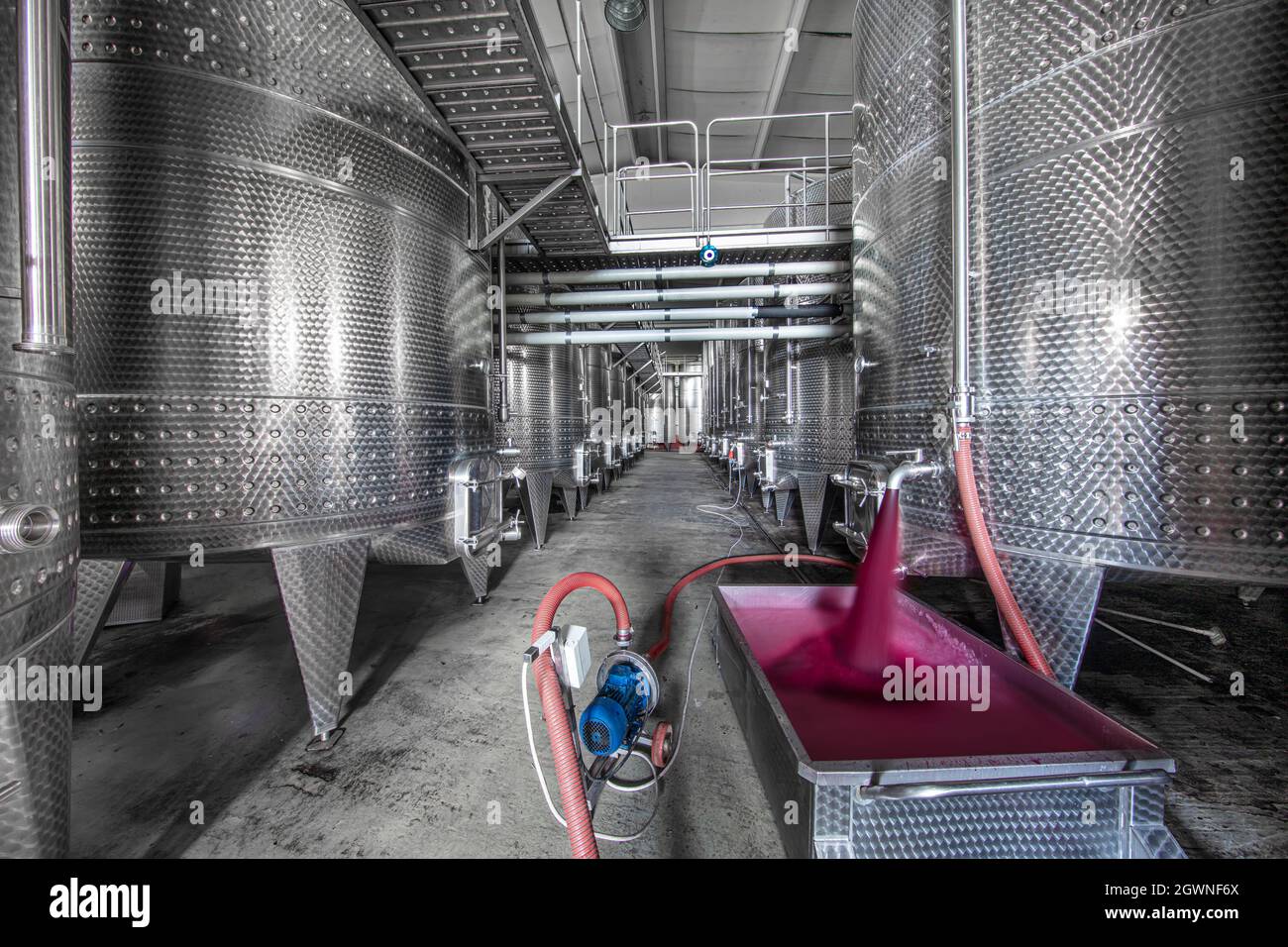 Winery producing wine, Grape ju in tank. Wine fermentation tanks. Wine ...