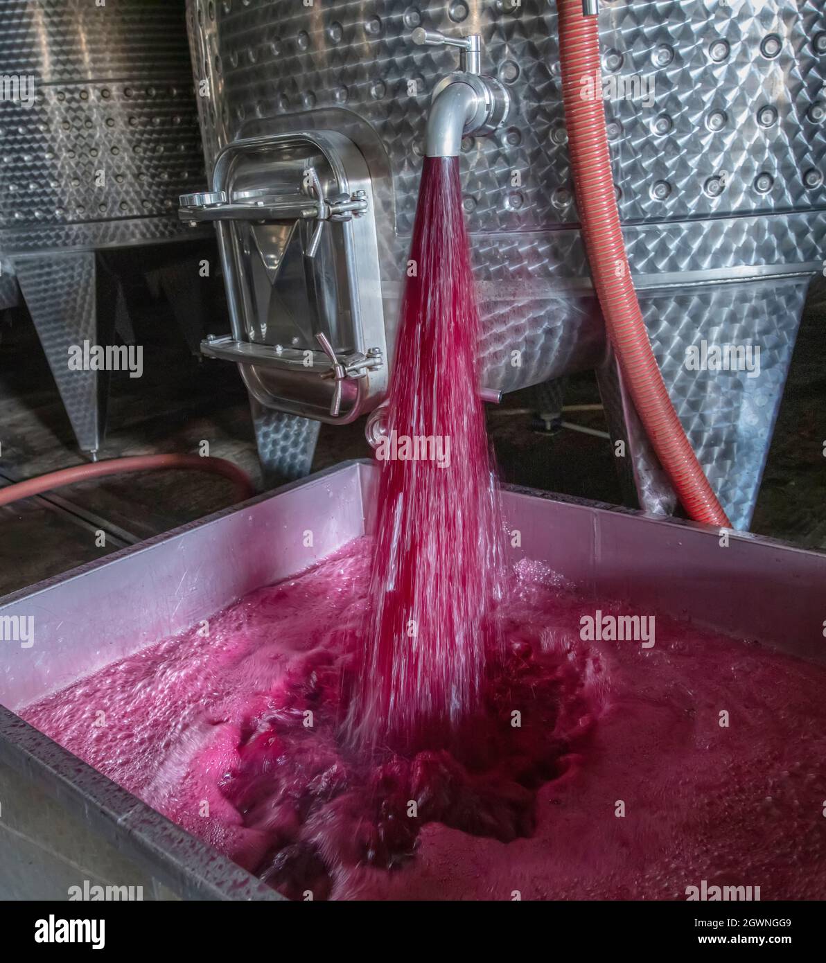 Winery producing wine, Grape ju in tank. Wine fermentation tanks. Wine ...