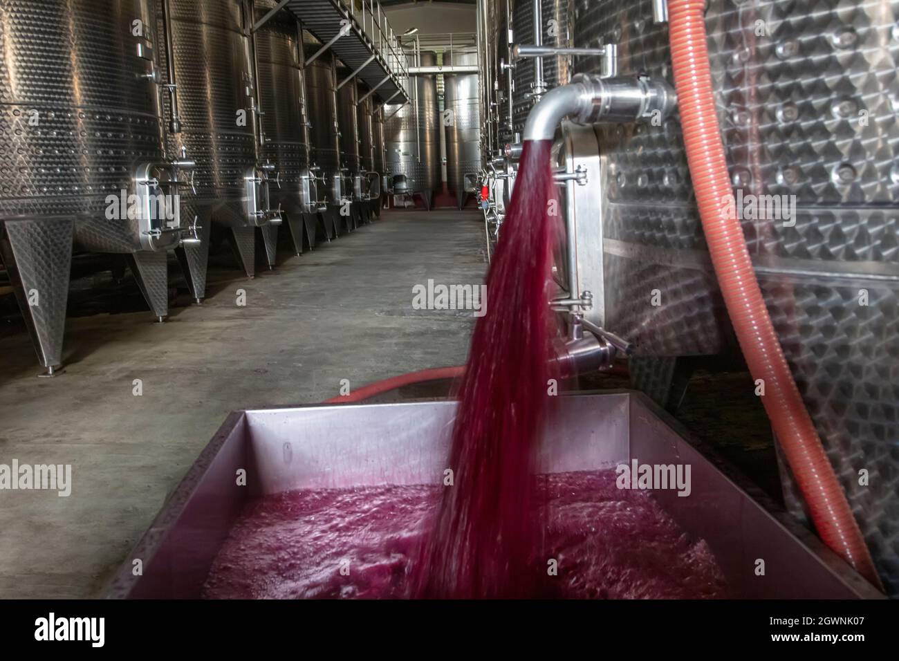 Winery producing wine, Grape ju in tank. Wine fermentation tanks. Wine ...