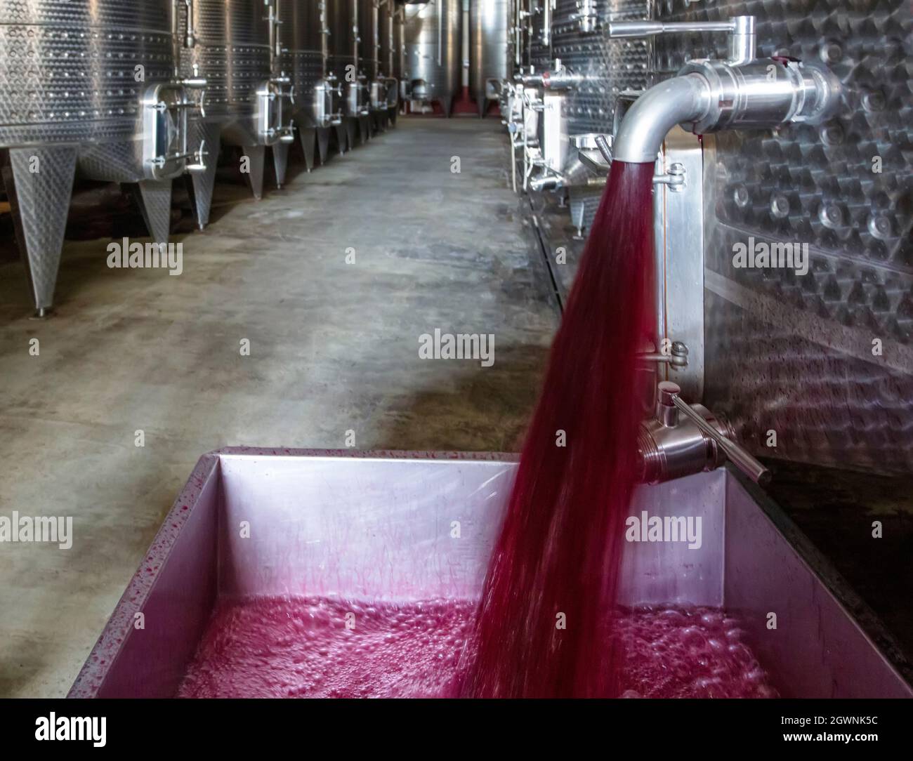 Winery producing wine, Grape ju in tank. Wine fermentation tanks. Wine ...