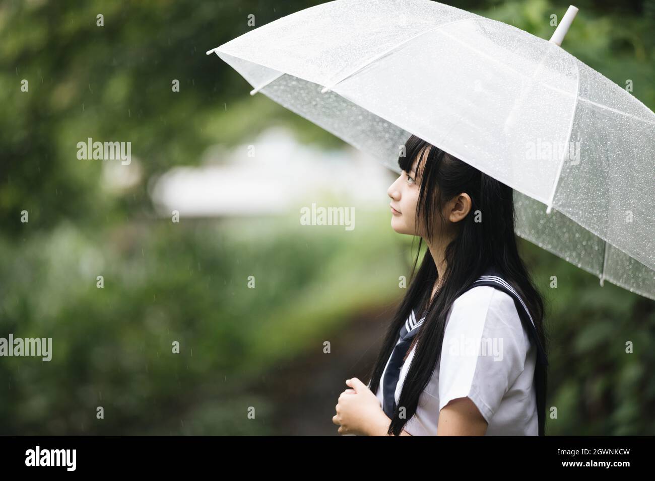 Girl Standing In The Rain
