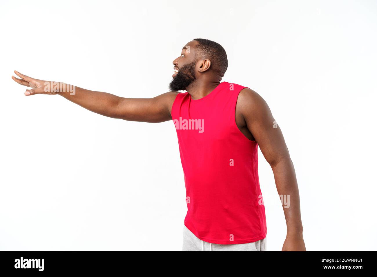 Young sport african american man extending hands to the side for ...