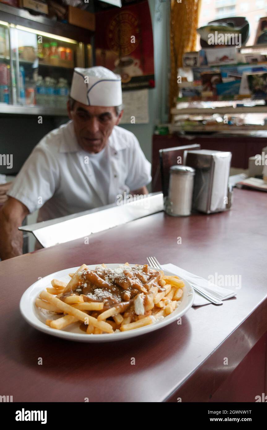 A plate of Greek poutine with feta cheese, a take on an iconic Canadian ...