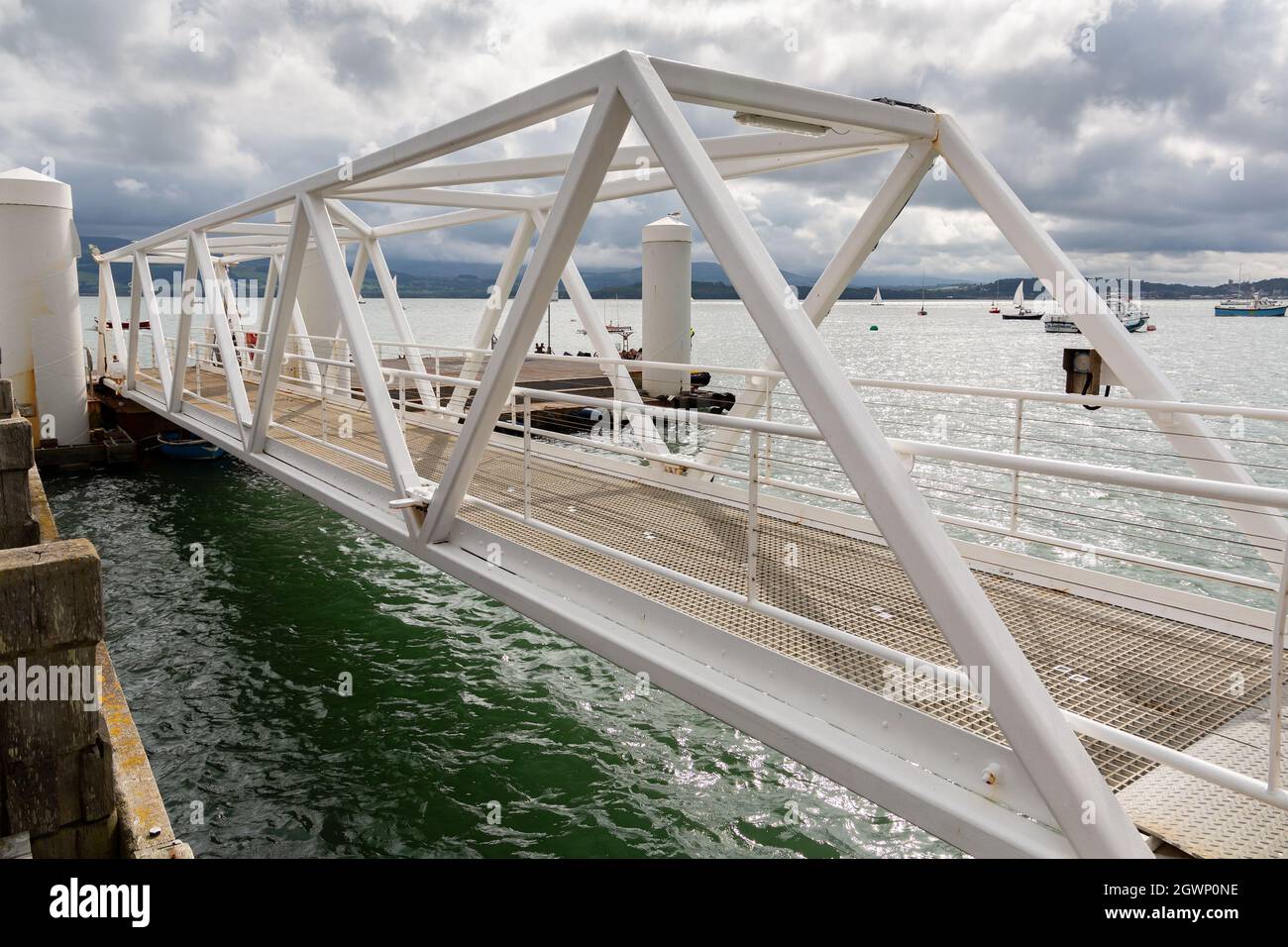 Beaumaris, UK: Pier walkway to landing stage and pontoon on the Menai ...