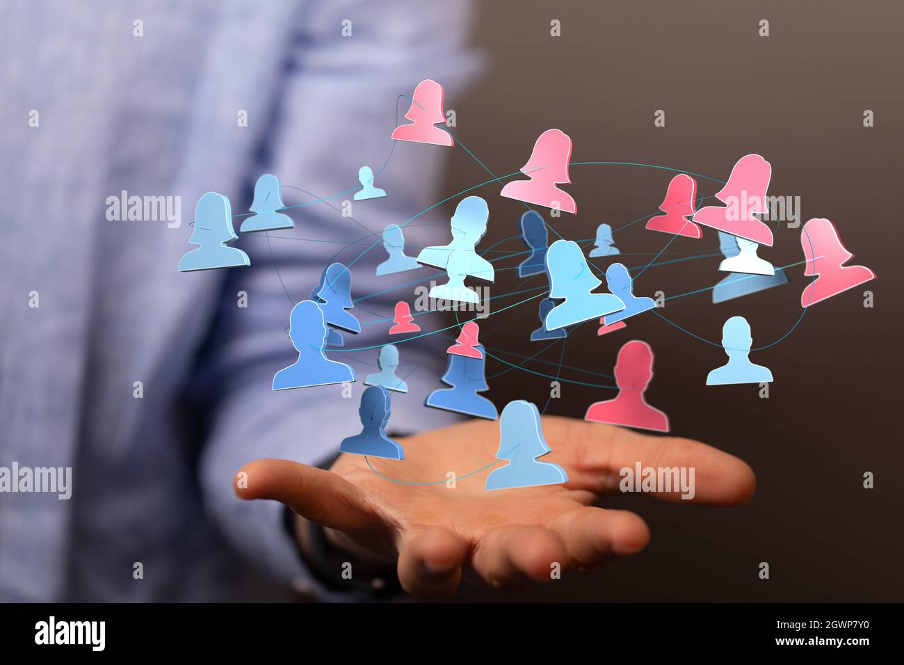 A person presenting a 3D rendered projection of teamwork Stock Photo ...