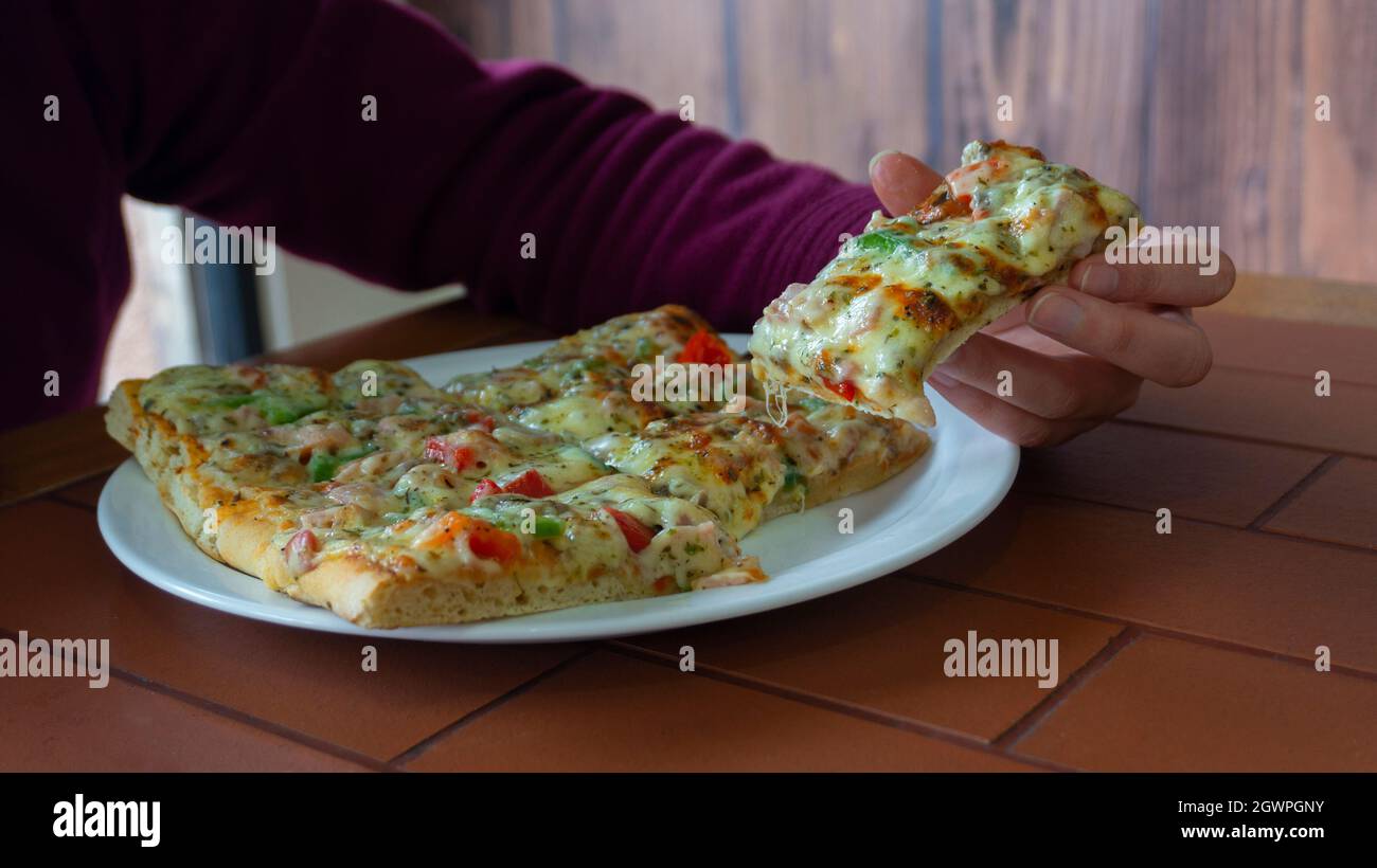Square pizza slice hi-res stock photography and images - Alamy