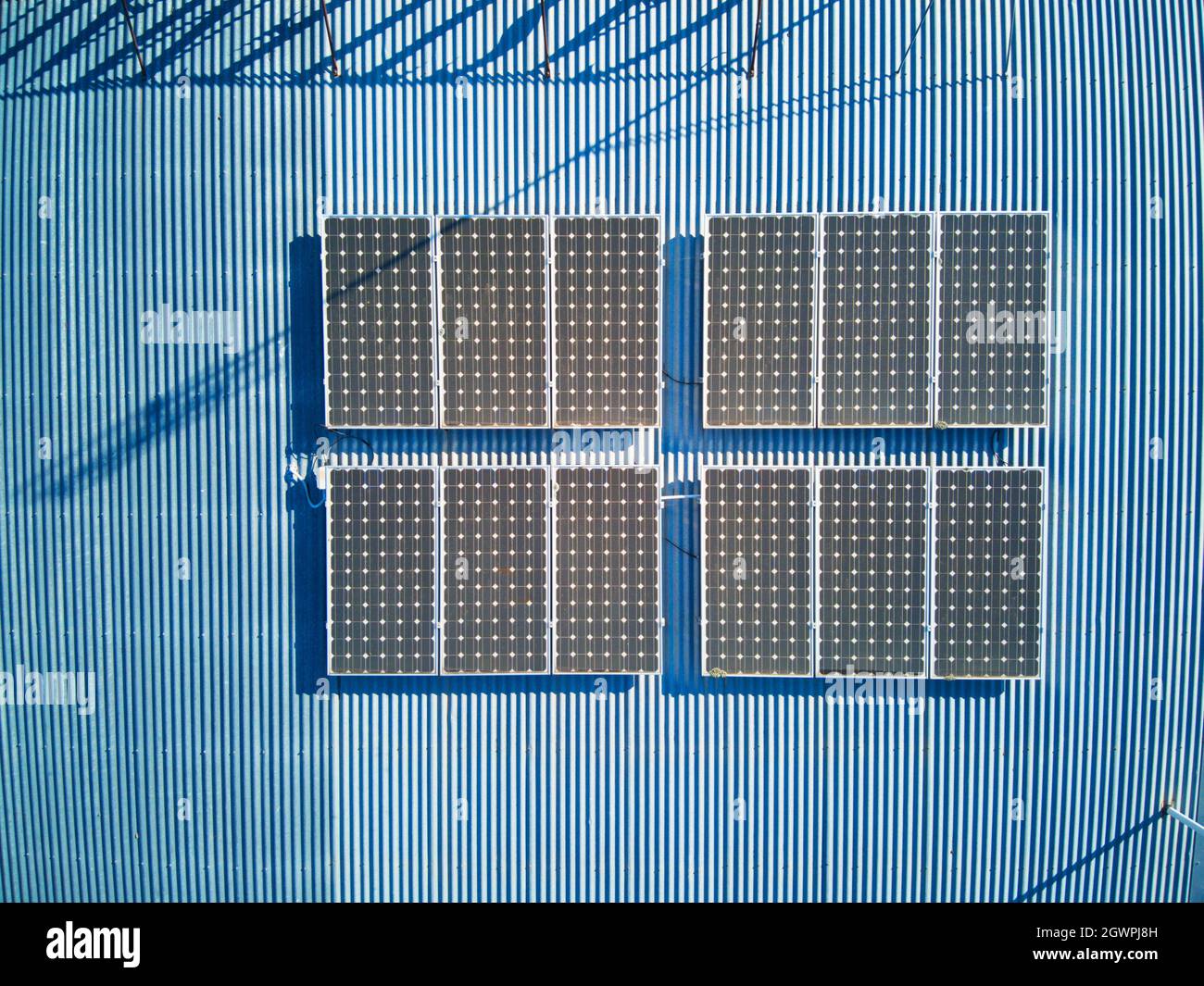 Building solar panels on roof with corrugated iron and shadows ...
