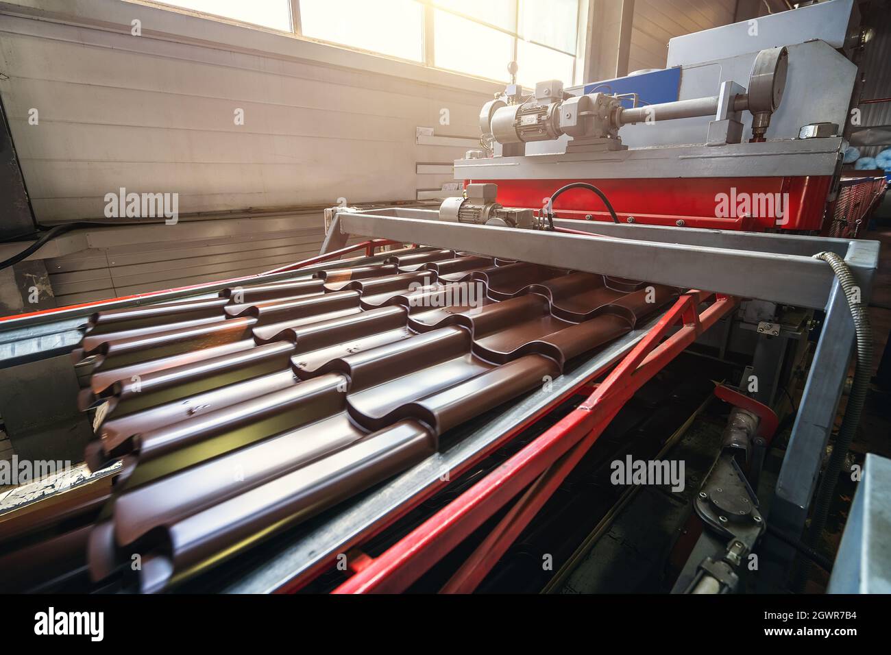Production line of metal tile for roof. Steel forming machine in ...