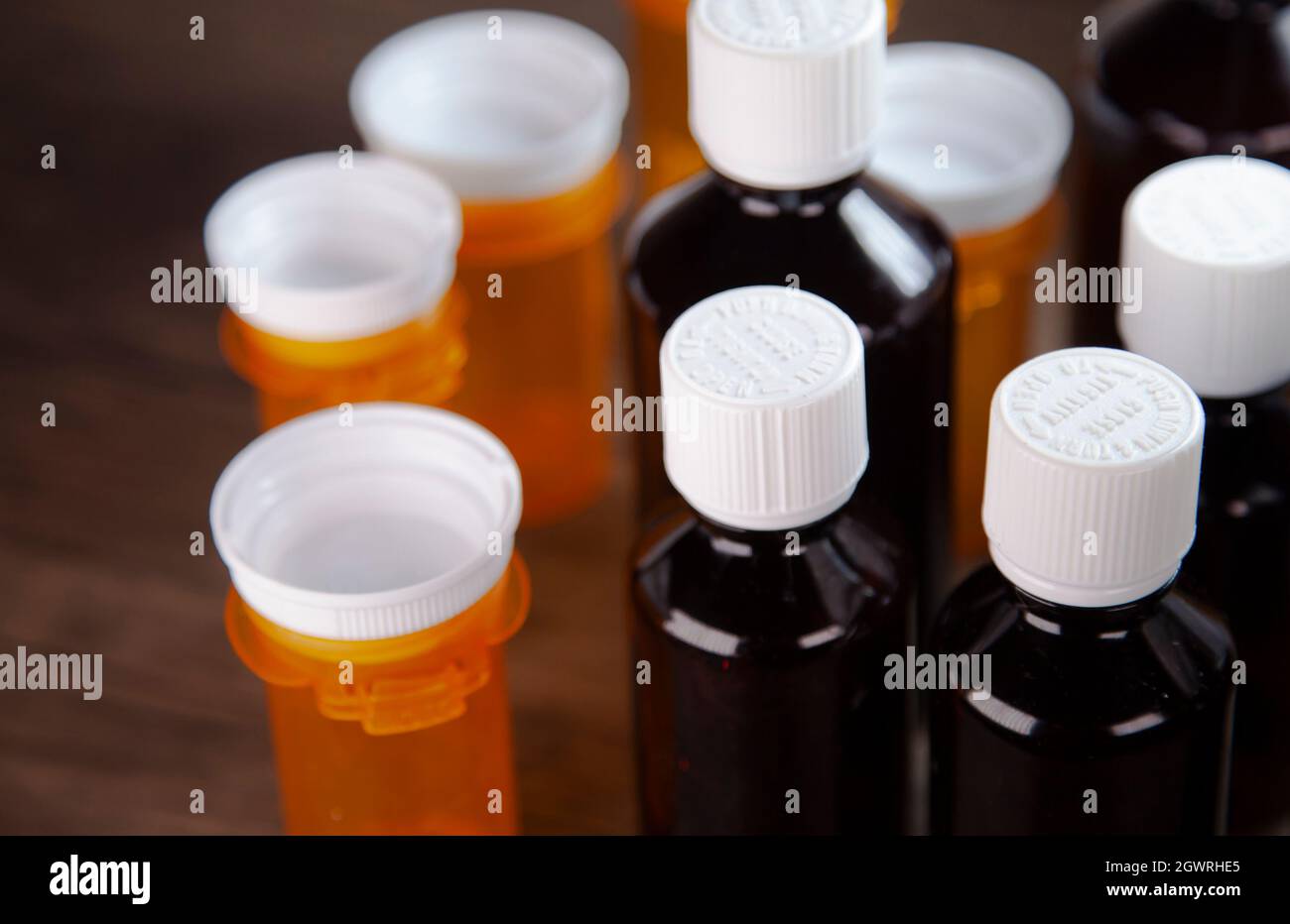 Cough syrup bottles and medication bottles on a table Stock Photo - Alamy