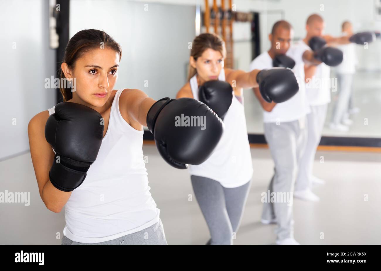 Portrait of young woman in boxing gloves Stock Photo - Alamy