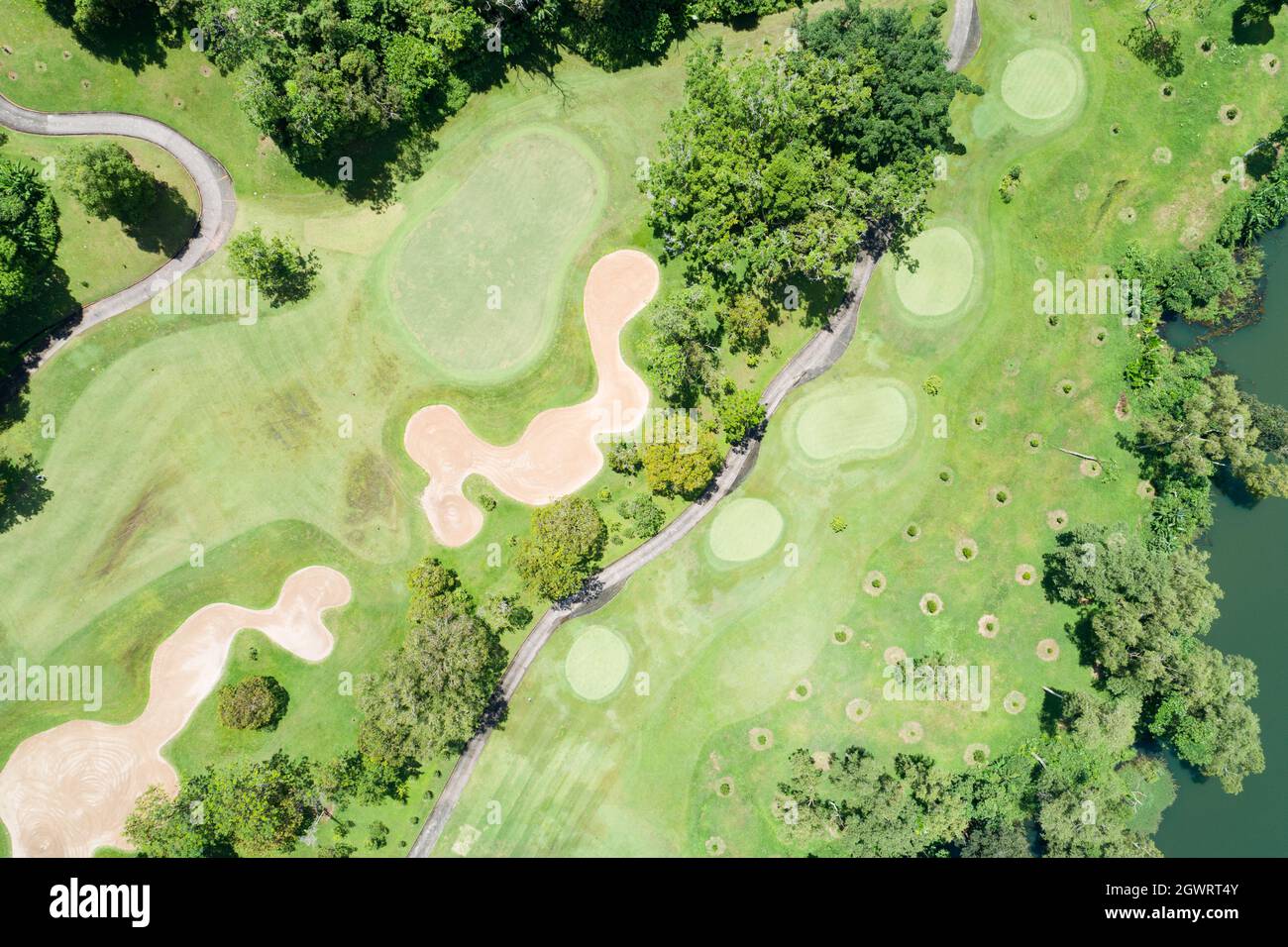 Aerial view drone shot of beautiful green golf field fairway and ...