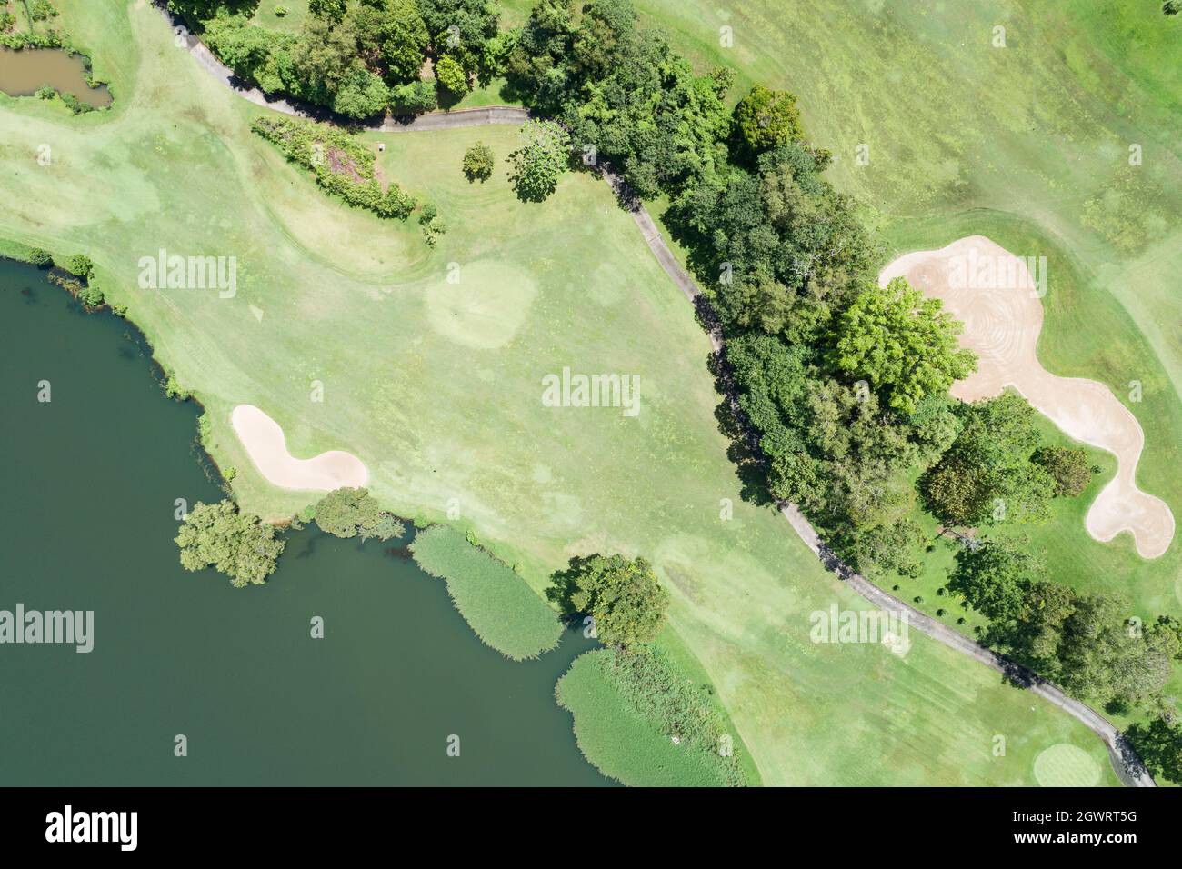 Aerial view drone shot of beautiful green golf field fairway and ...