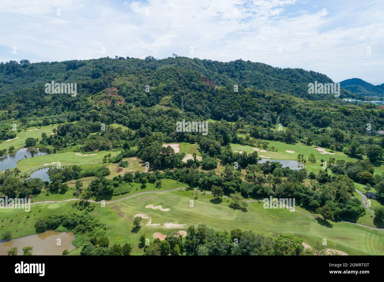 Aerial view drone shot of beautiful green golf field fairway and ...