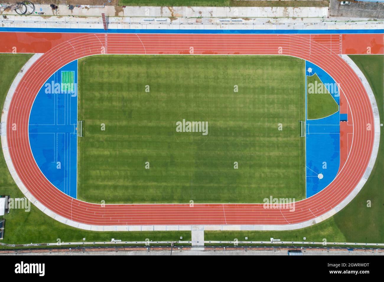 Aerial view of empty new soccer field from above with running tracks ...
