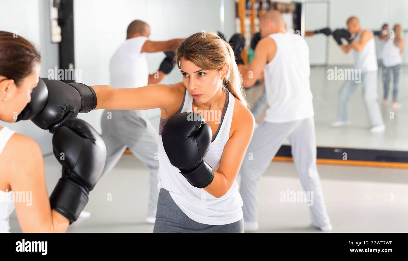 Two women boxing gloves hi-res stock photography and images - Alamy