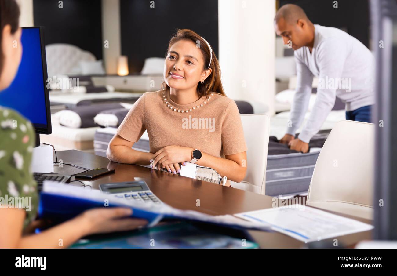 Shop assistant talking customer shopping hi-res stock photography and ...