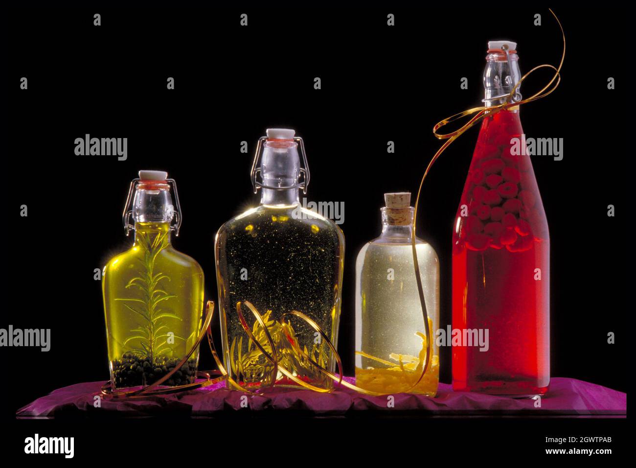 Colored bottles of oils Stock Photo - Alamy