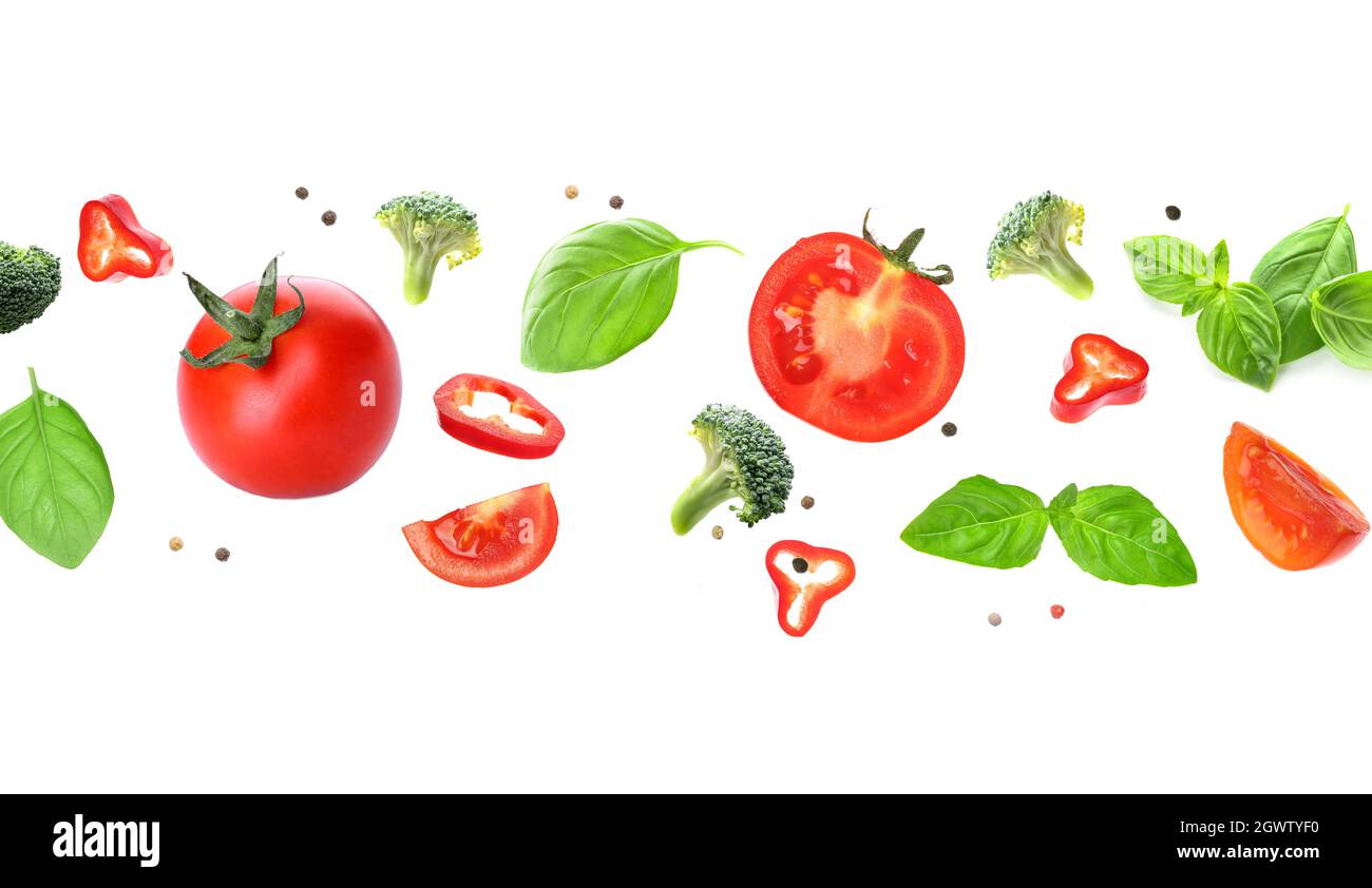 Flying fresh vegetables and herbs on white background Stock Photo - Alamy