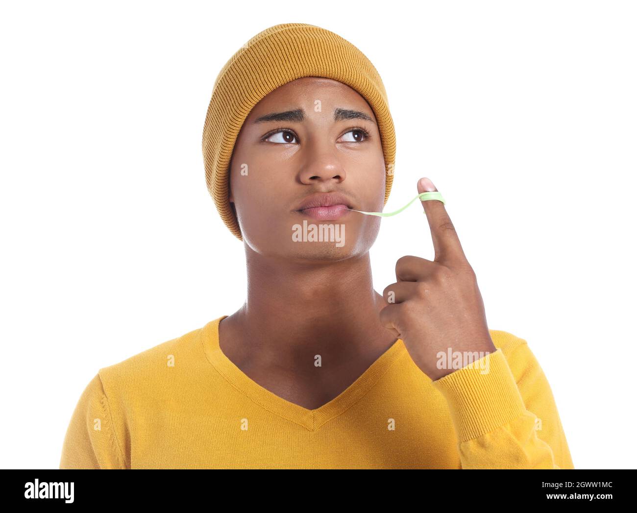Sad African-American guy with chewing gum on white background Stock ...