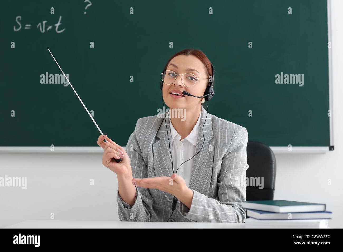 Math teacher conducting lesson hi-res stock photography and images - Alamy