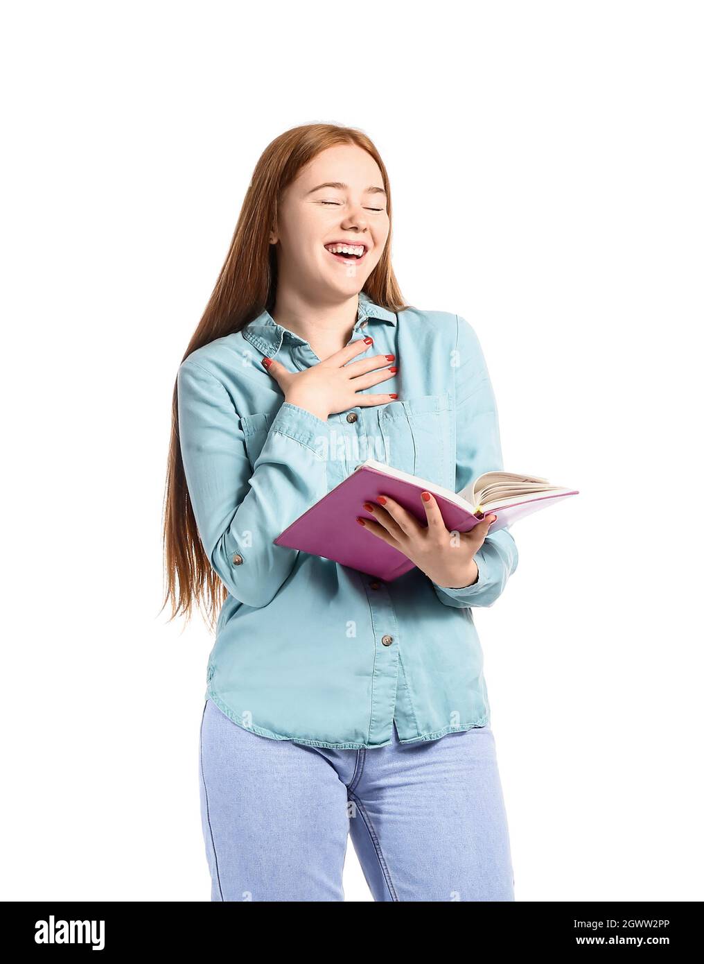 Happy young woman reading book on white background Stock Photo - Alamy