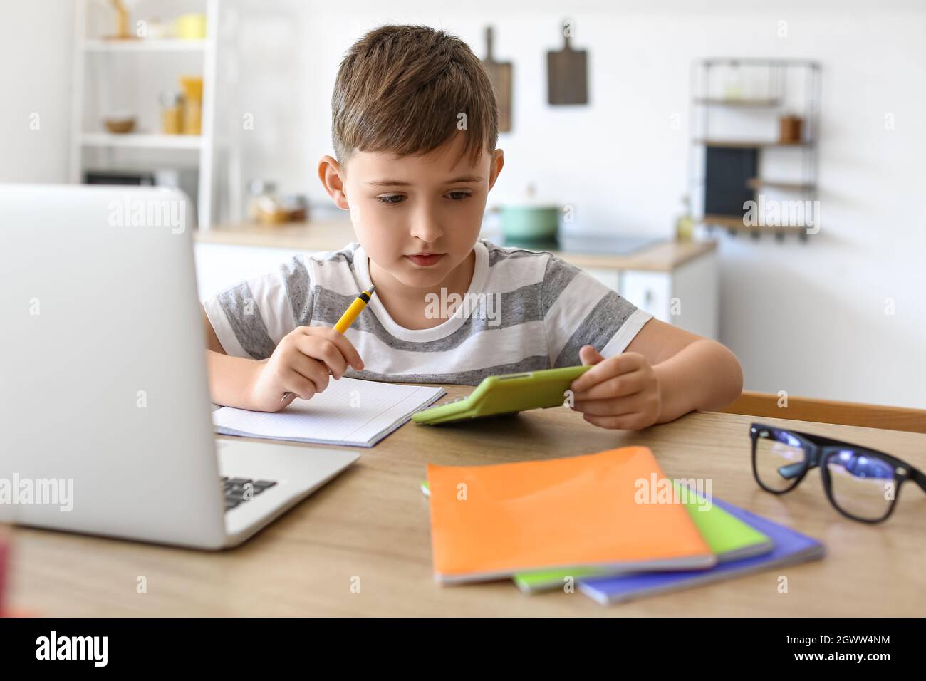 Little boy doing homework in room Stock Photo - Alamy