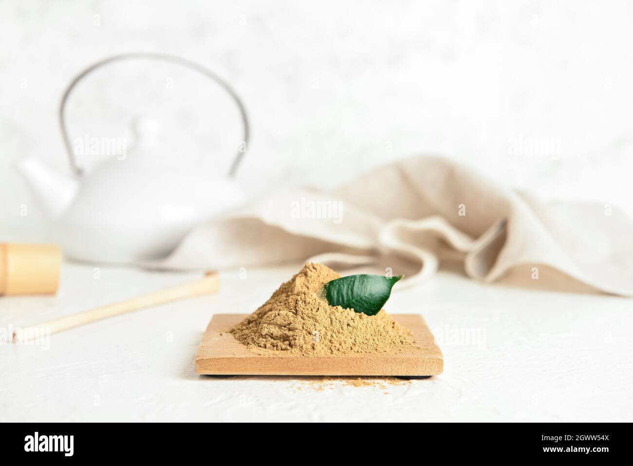 Pile of hojicha powder on white background Stock Photo - Alamy
