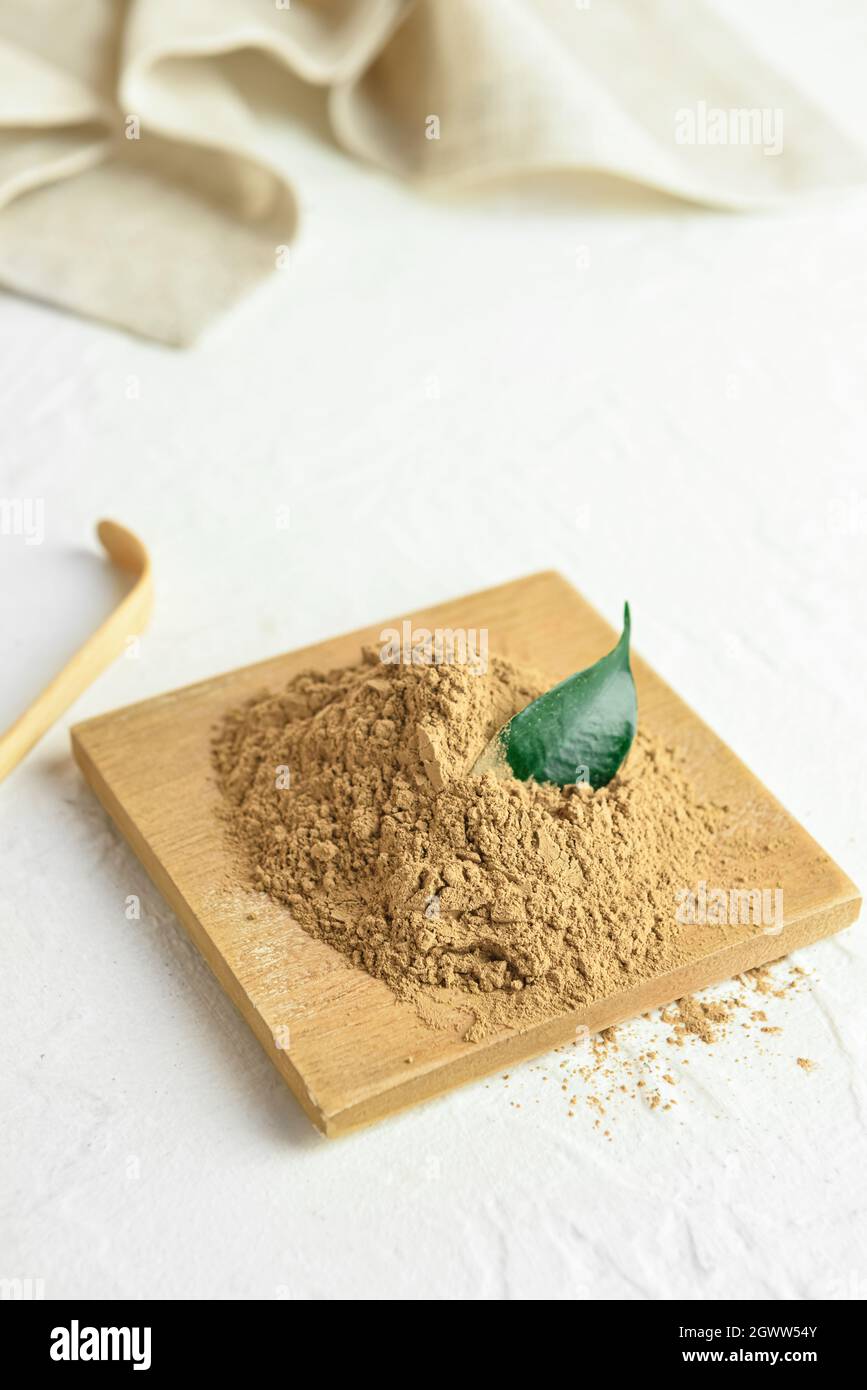 Pile of hojicha powder on white background Stock Photo - Alamy